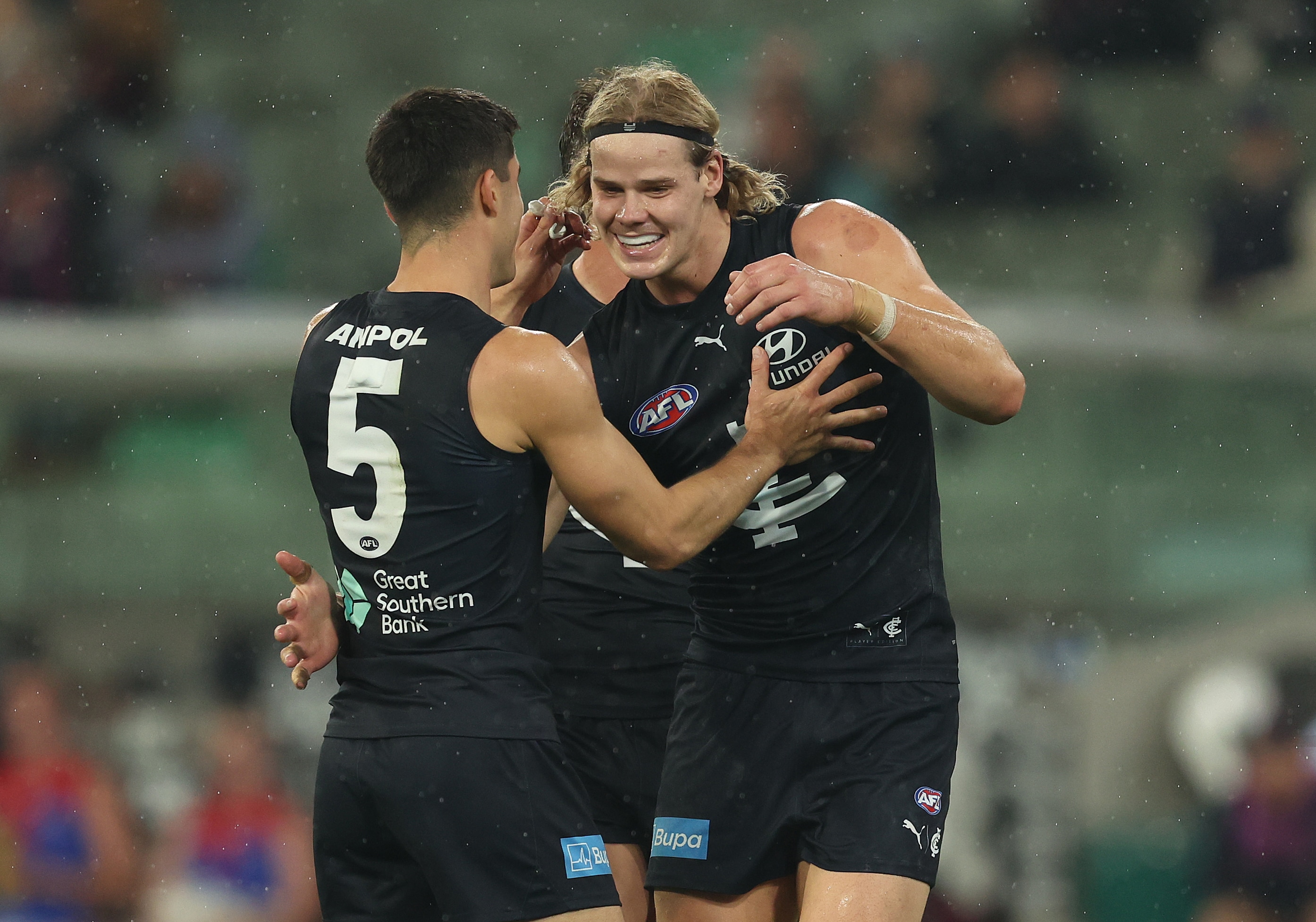 AFL match report: Carlton holds on for crucial win
