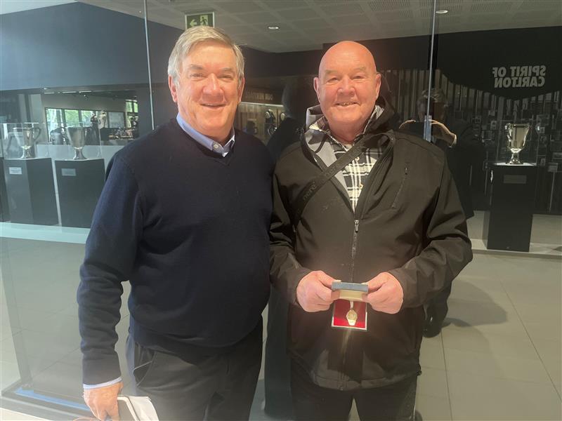 Clements takes possession of his club's B & F Medal ... finally